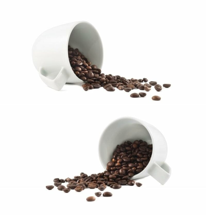 Spilled coffee beans from the cup isolated - Glassing